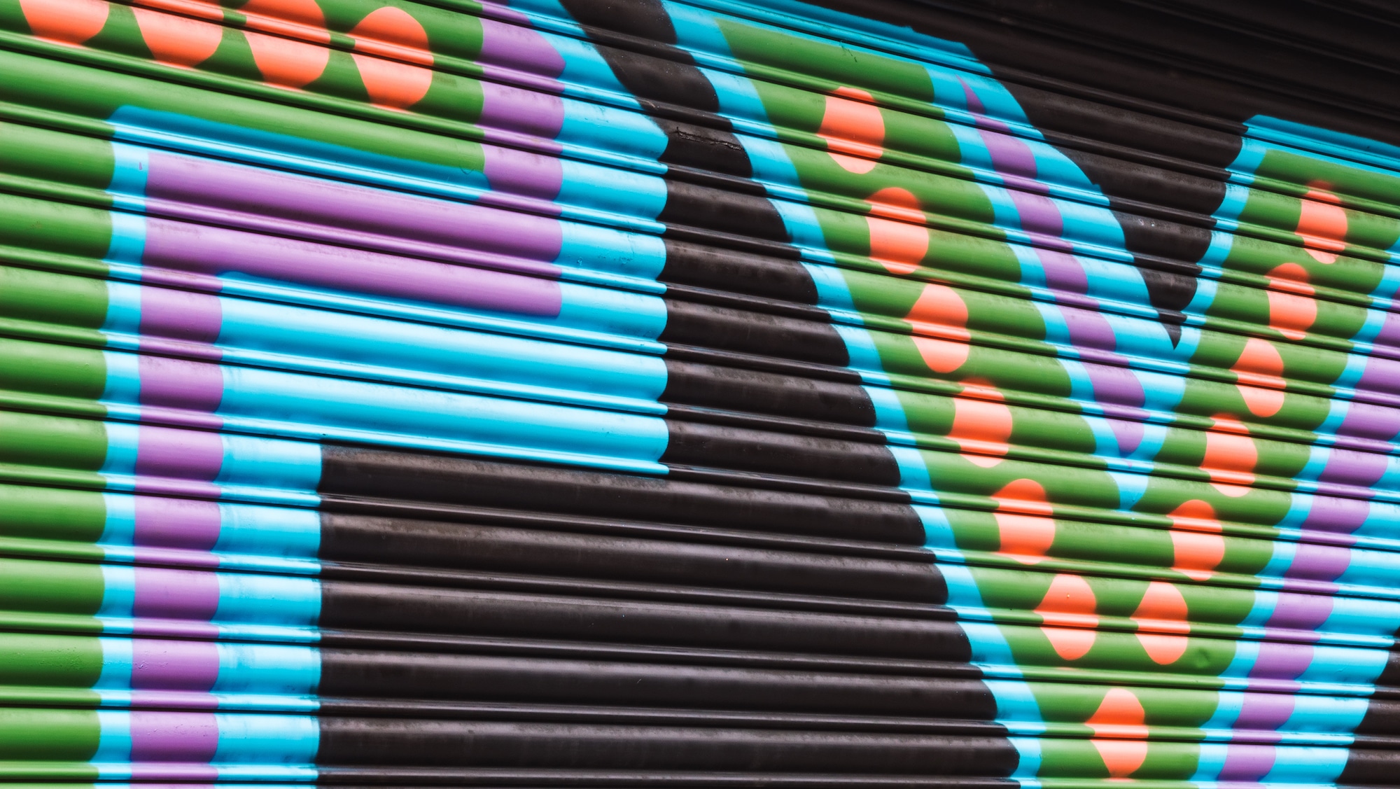 The Full English Alphabet Painted on Store Shutters in 26 Different ...